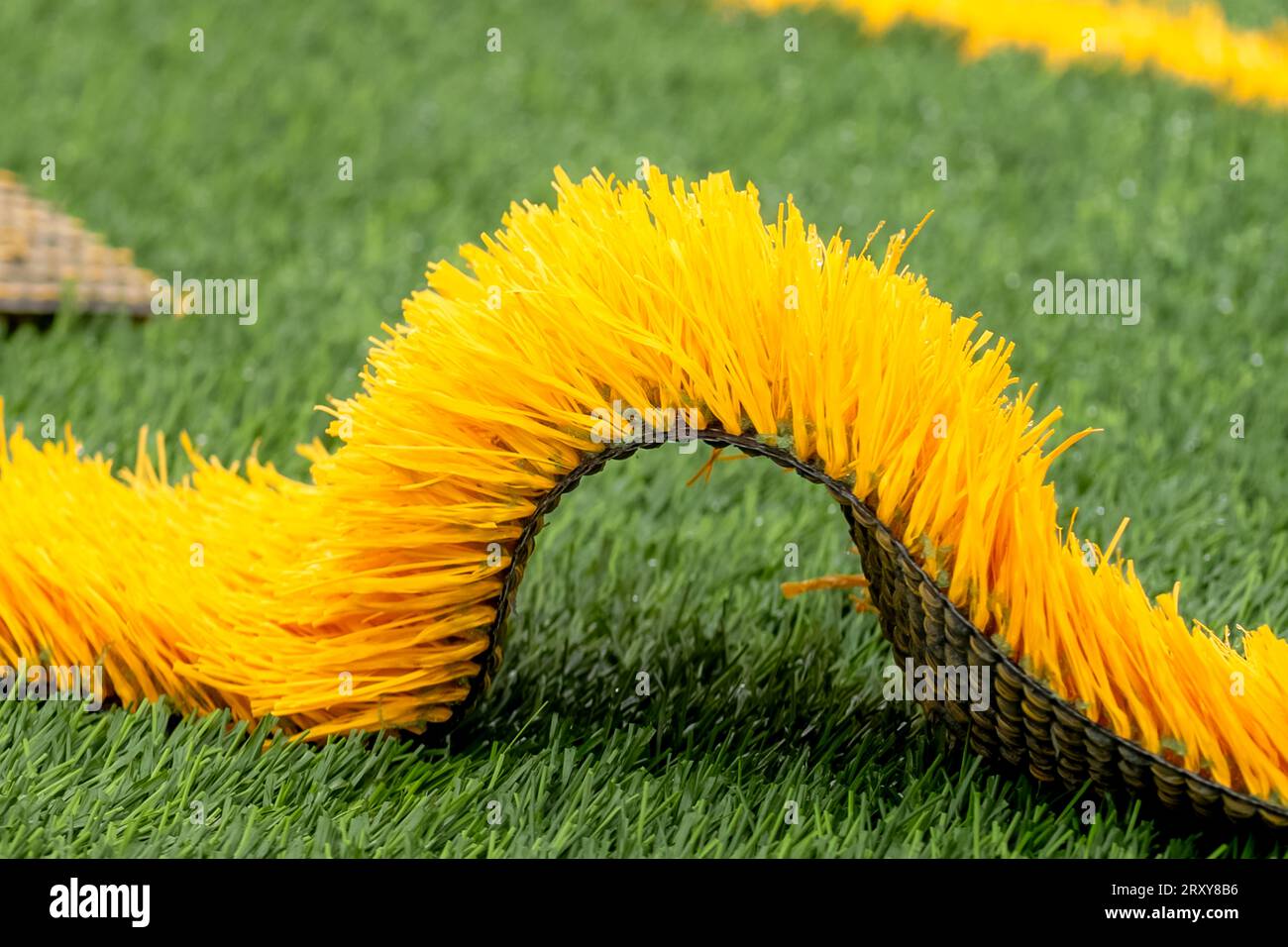 Synthetic turf field under construction with lines and graphics being ...