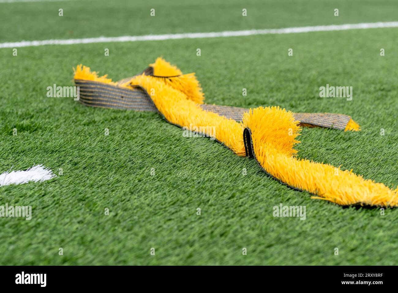 Synthetic turf field under construction with lines and graphics being ...