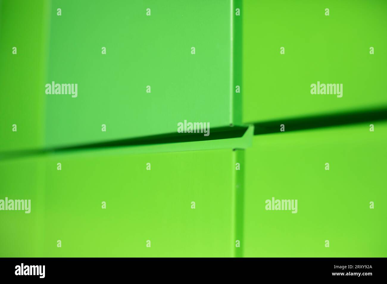 Green metal wall. Square wall slabs. Exterior of building. Green design ...