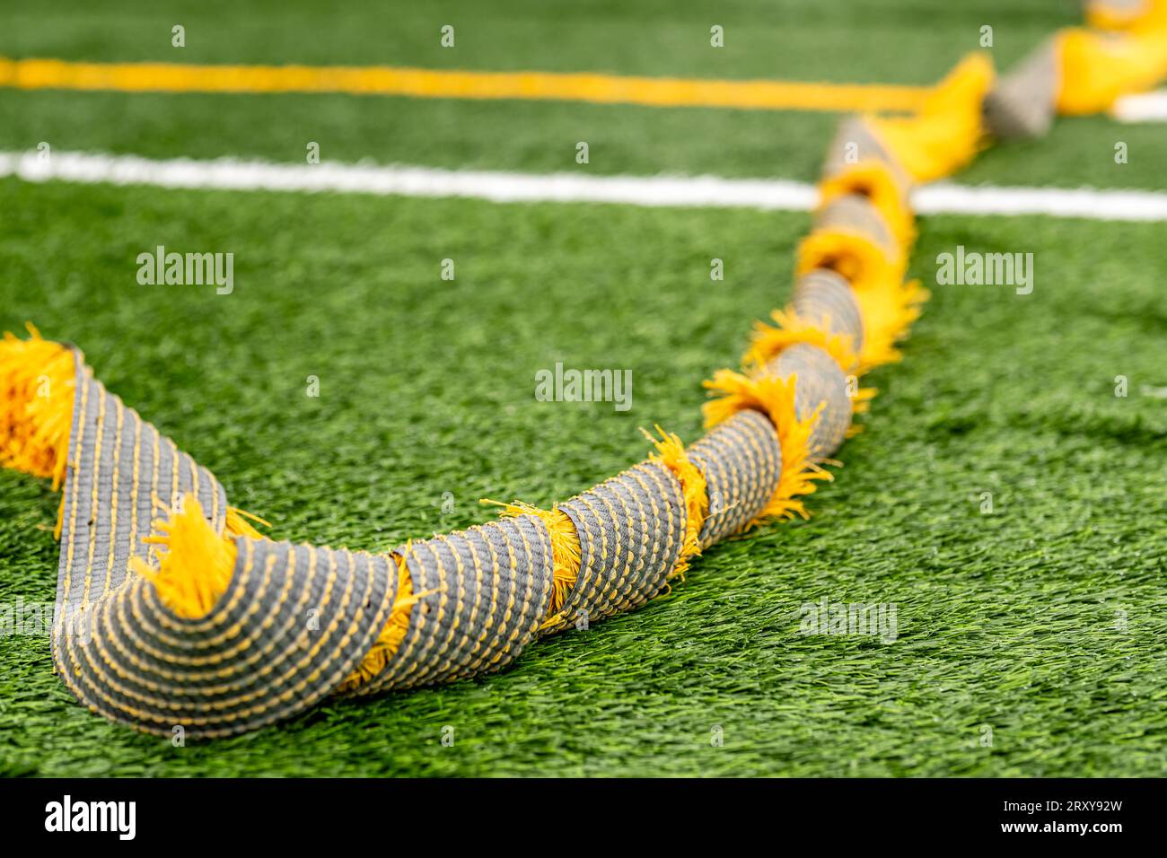 Synthetic turf field under construction with lines and graphics being ...