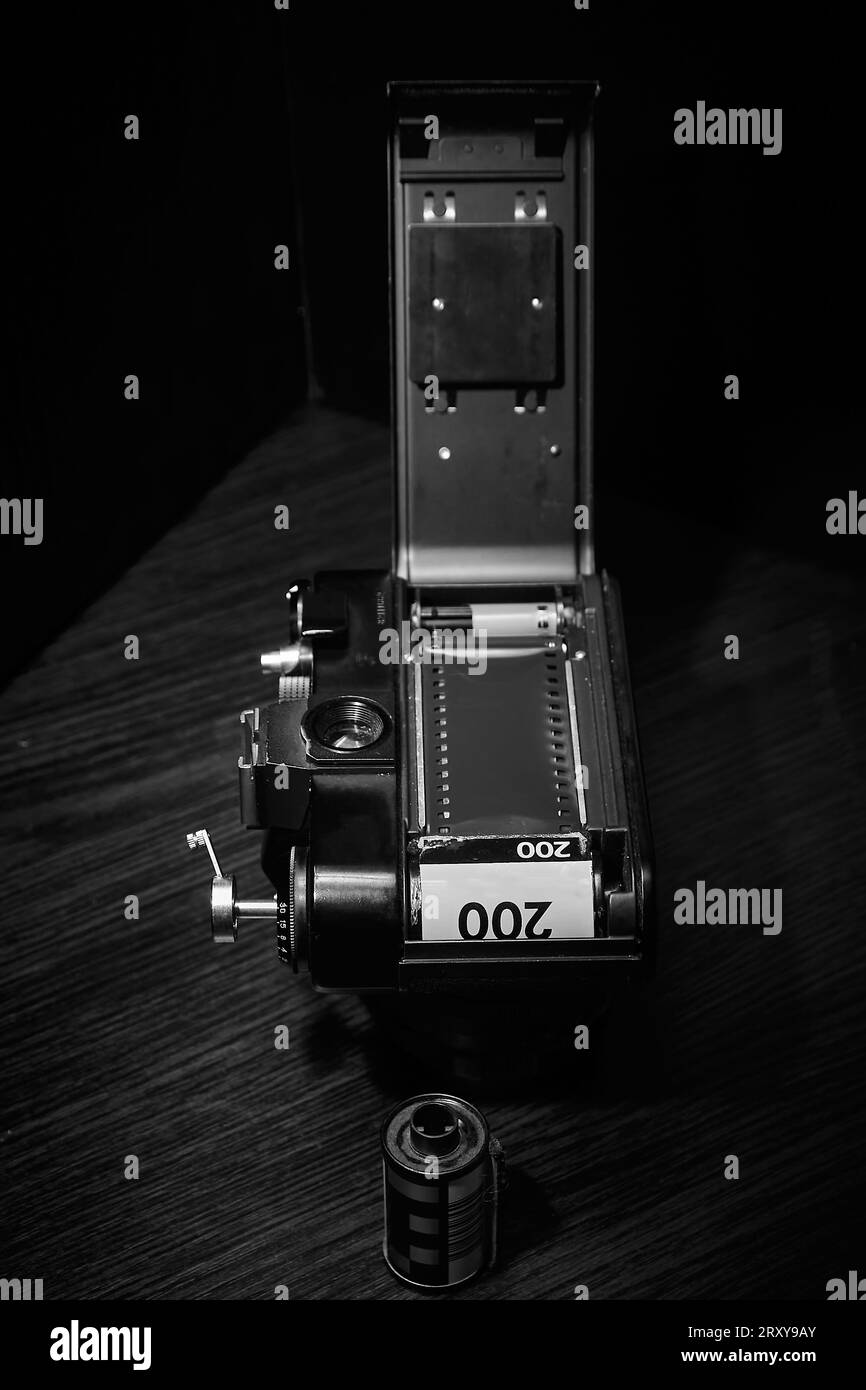 Installing 35mm film in an old camera - rear view Stock Photo - Alamy