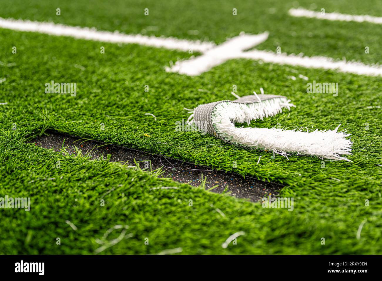 Synthetic turf field under construction with lines and graphics being ...