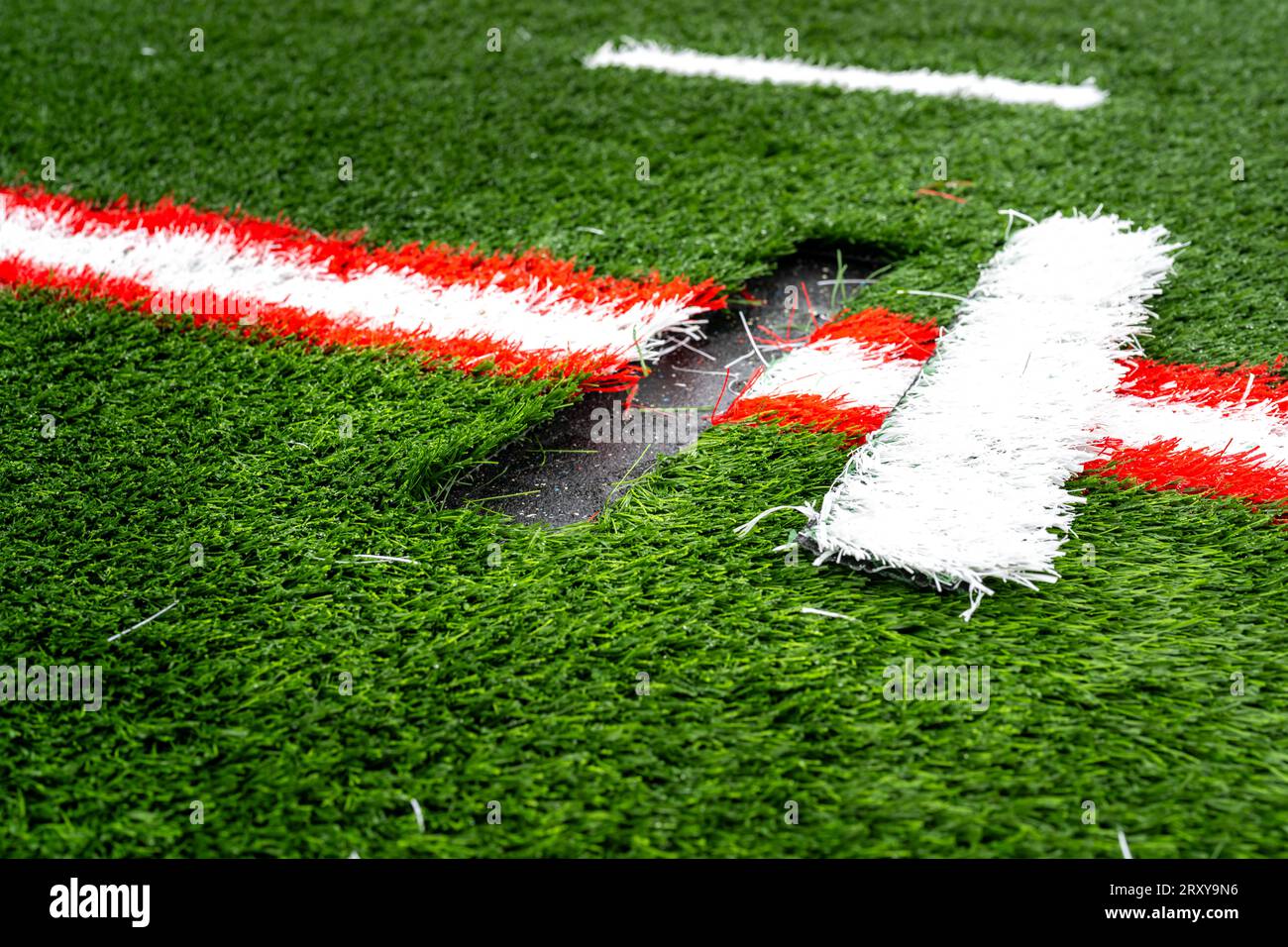 Synthetic turf field under construction with lines and graphics being ...