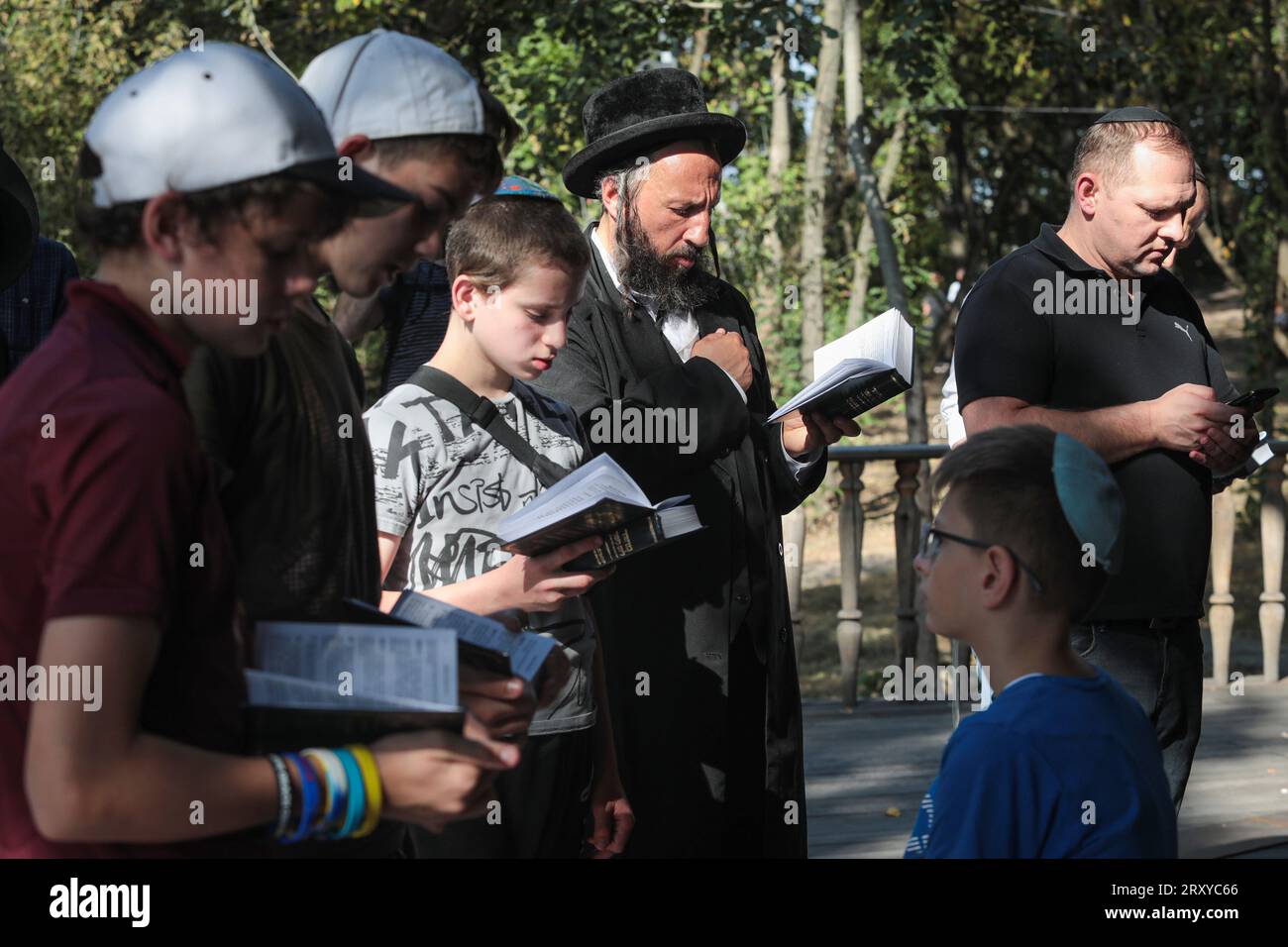 Non Exclusive: KYIV, UKRAINE - SEPTEMBER 24, 2023 - Men read prayer ...