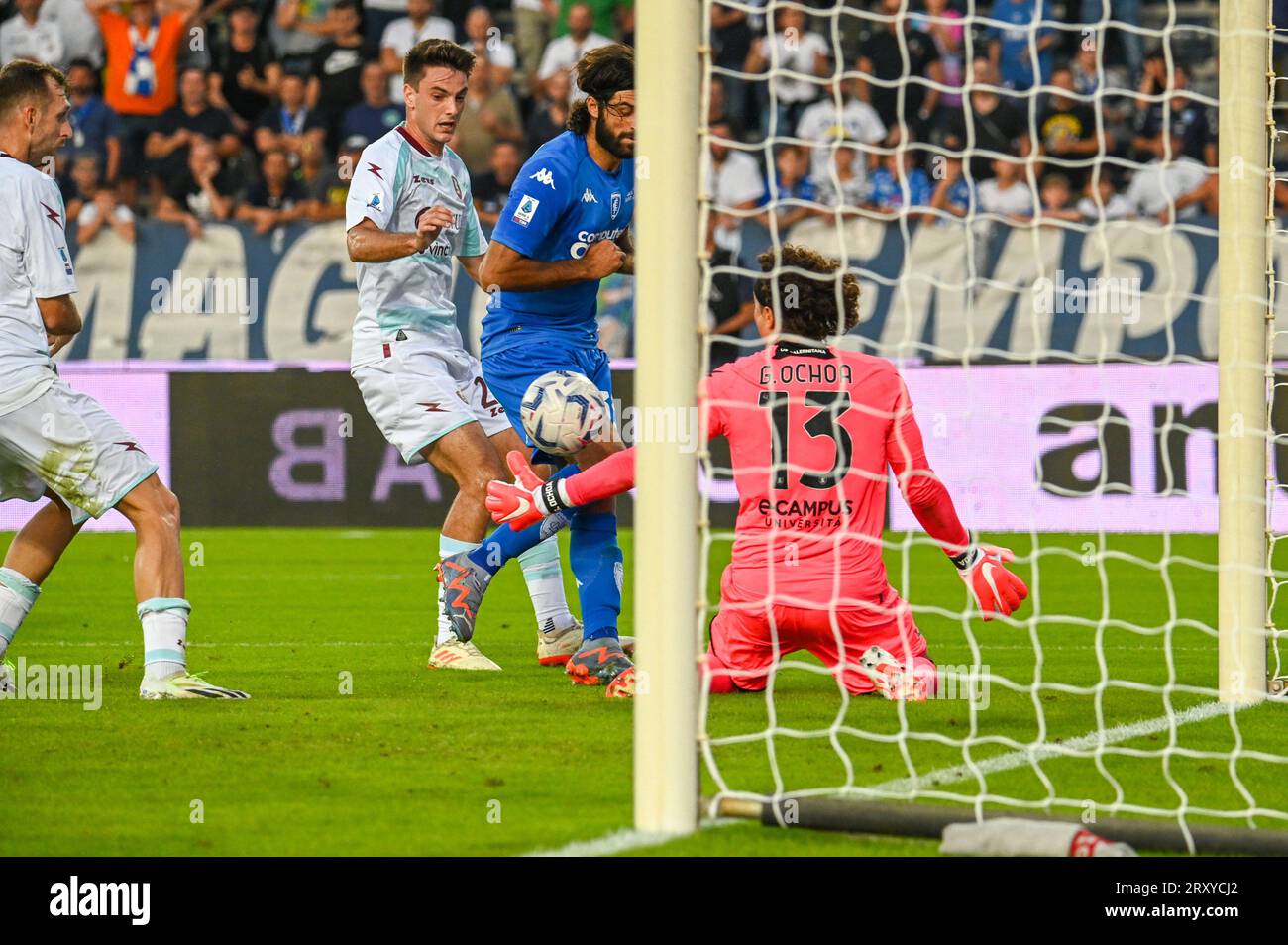 Salernitana's Guillermo Ochoa saves a goal against Empoli's Sebastiano ...