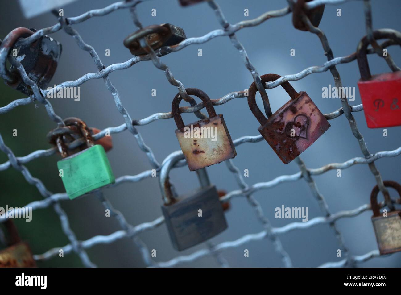 Old and new locks with names and dates written on them couples ...