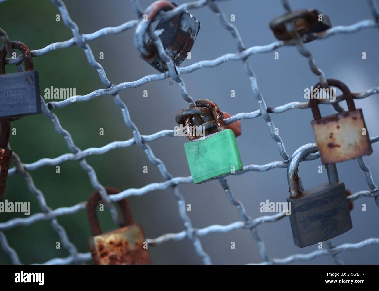 Old and new locks with names and dates written on them couples ...