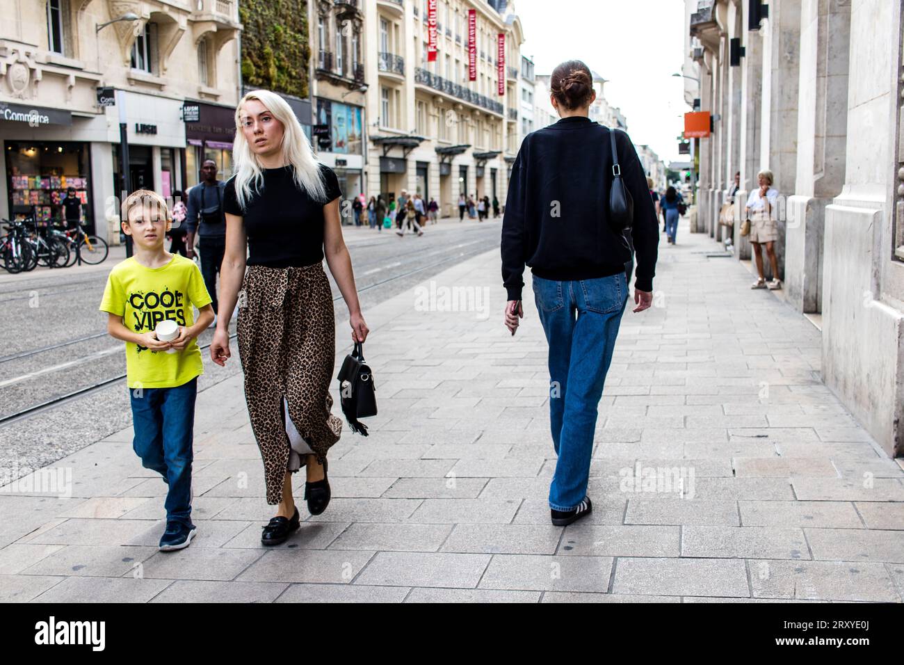 Reims, France - September 26, 2023 People wandering in the street of ...