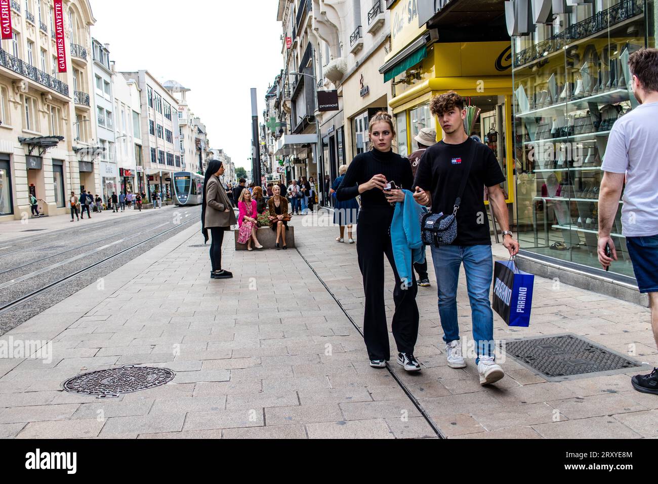 Reims, France - September 26, 2023 People wandering in the street of ...