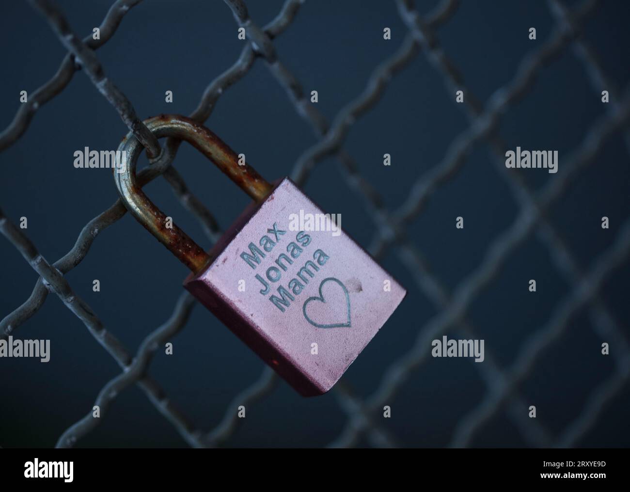 Old and new locks with names and dates written on them couples ...