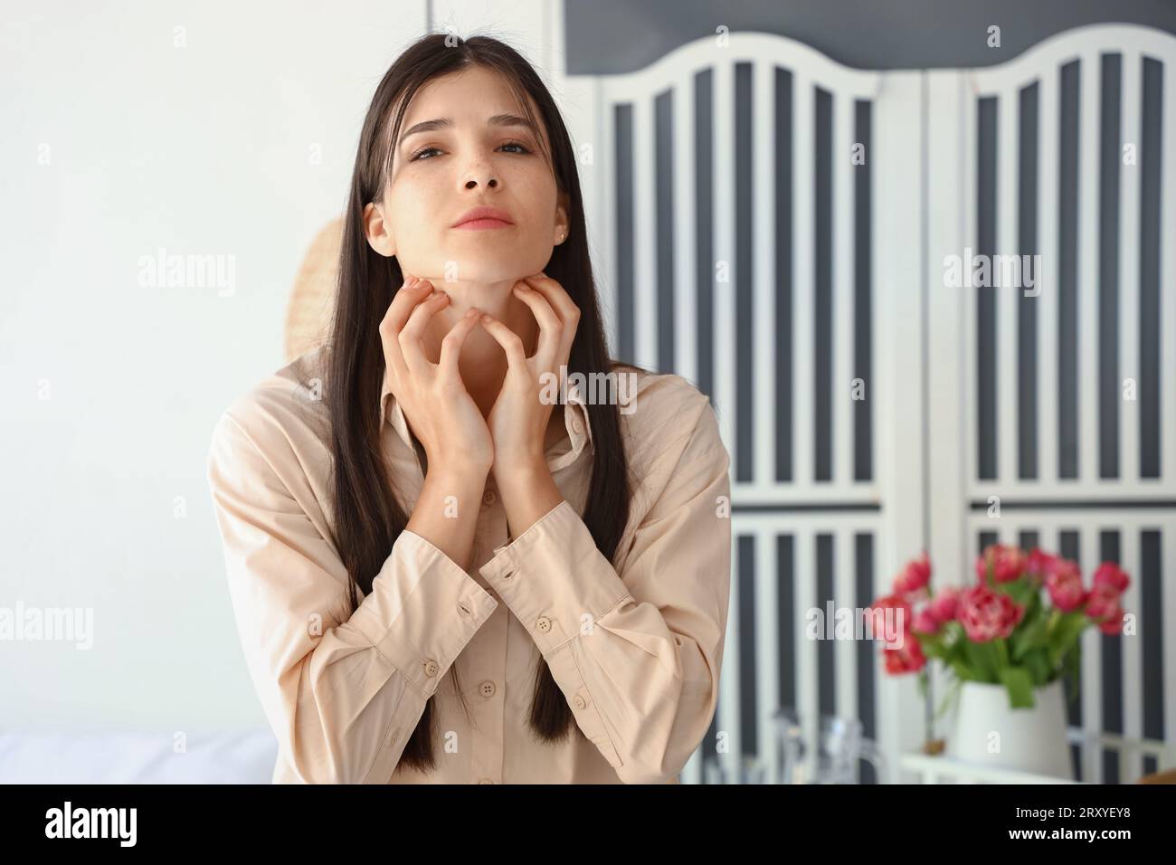 Allergic young woman scratching in bedroom Stock Photo - Alamy