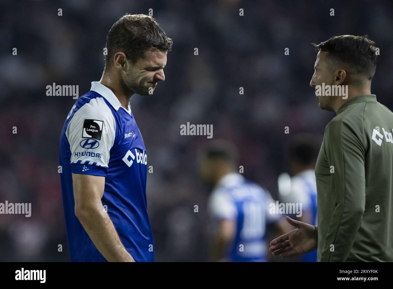 Gent's Hugo Cuypers leaves the pitch after being injured during a soccer match between Royal ...