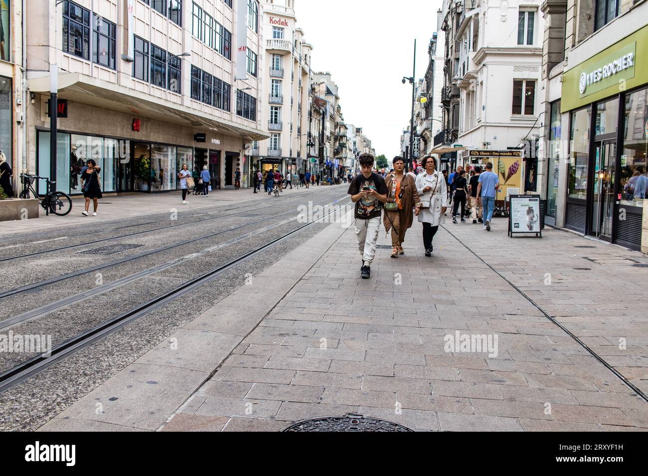 Reims, France - September 26, 2023 People wandering in the street of ...