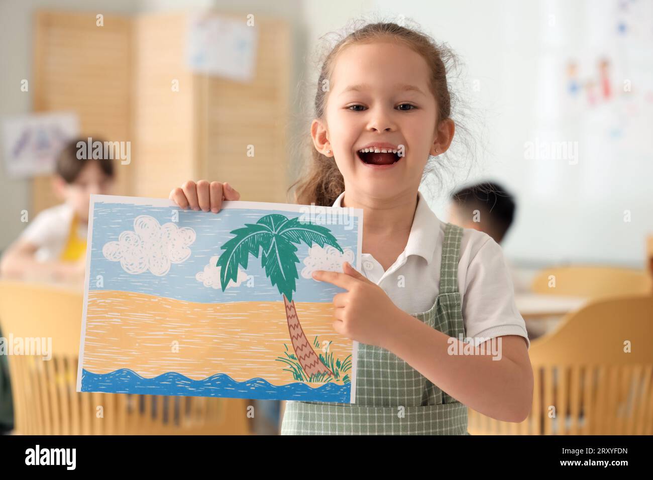 Cute little girl with drawing in art class Stock Photo - Alamy