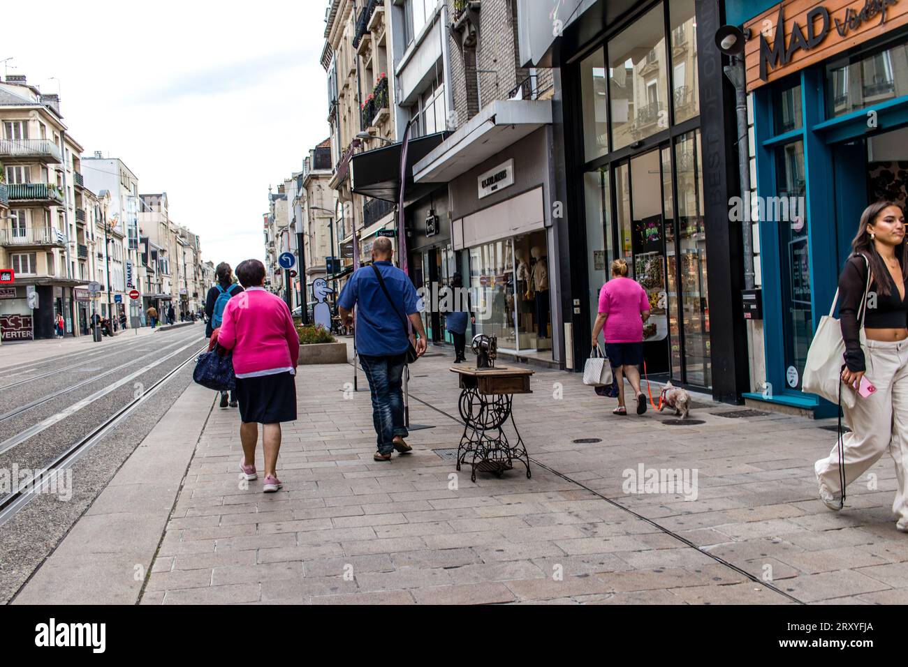 Reims, France - September 26, 2023 People wandering in the street of ...