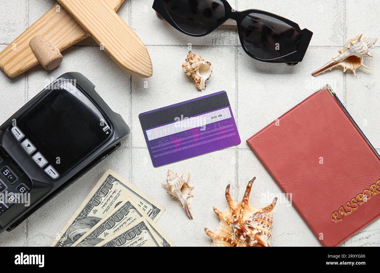 Composition with credit card, payment terminal, passport and seashells ...