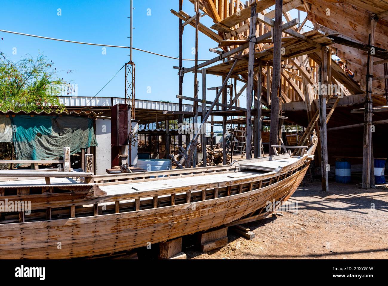 Traditional method of building dhow boats from wood in Sur, Oman Stock ...