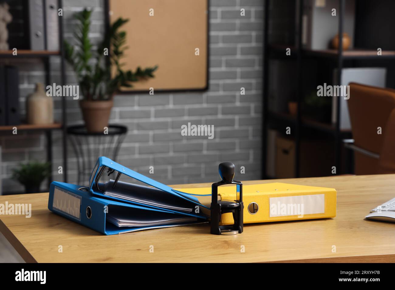 Document folders with stamp on desk in office Stock Photo - Alamy