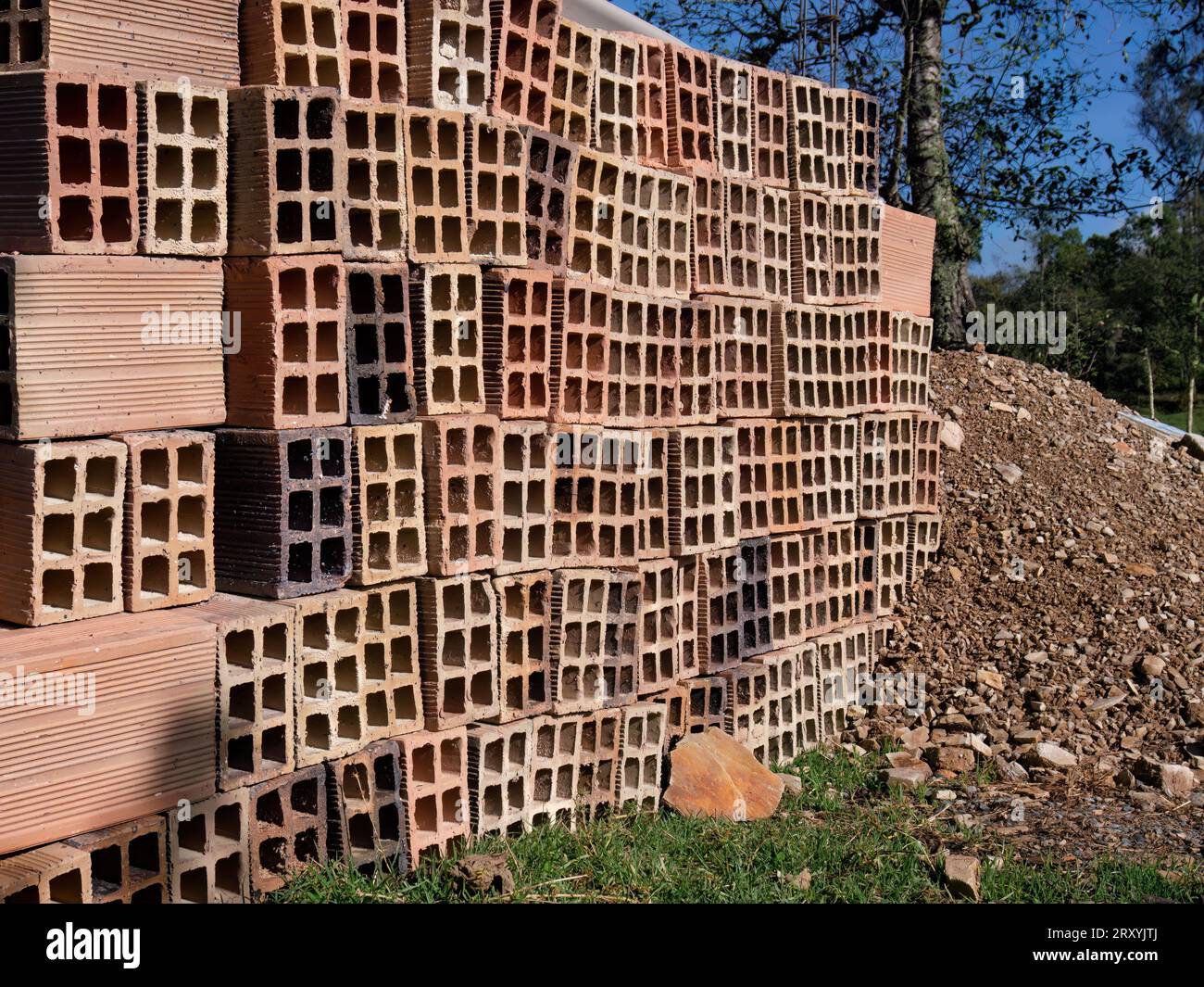 A stack of hollow clay blocks in a construction site, in a farm in the eastern Andean mountains ...