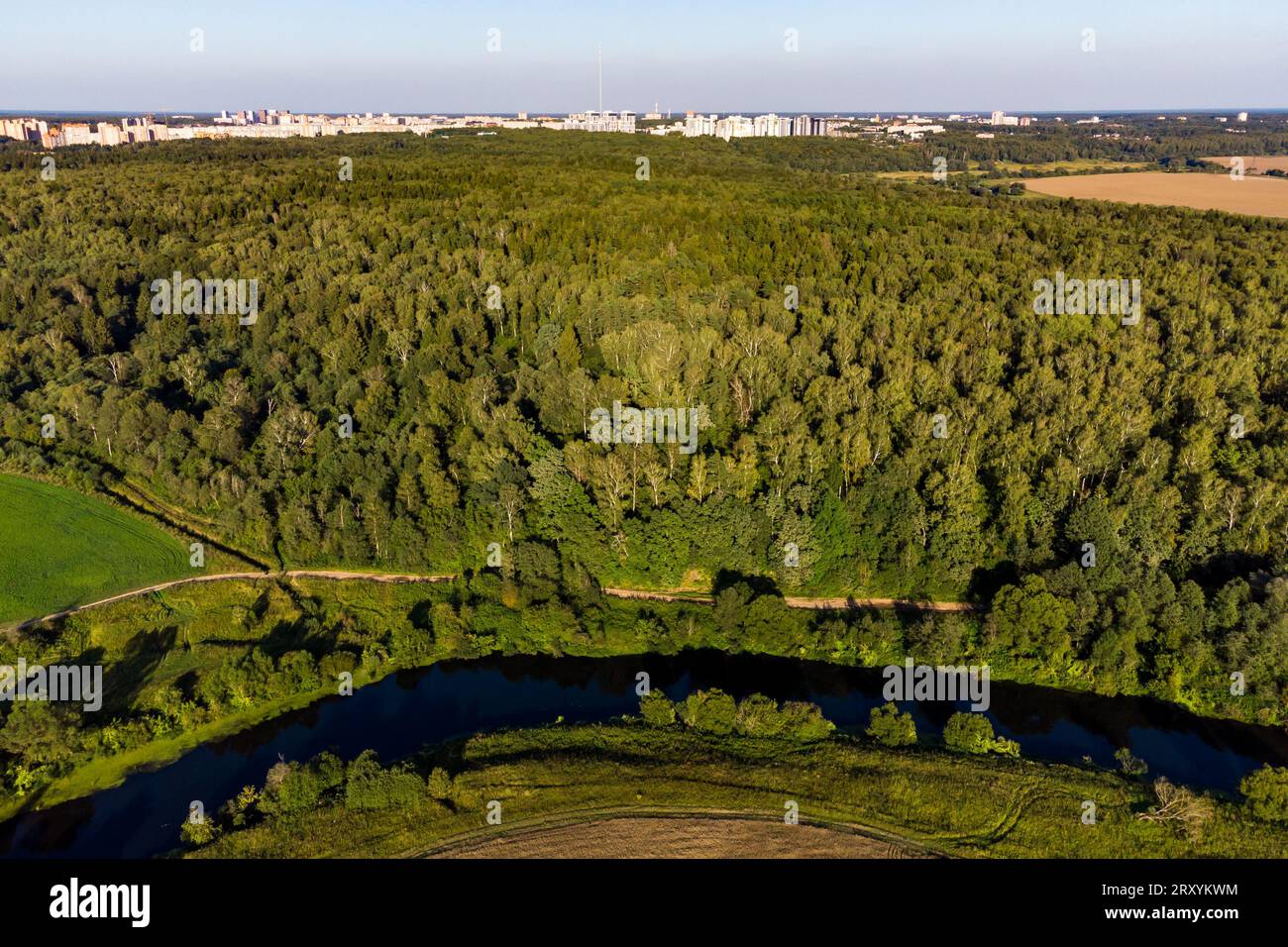 Green landscape from the air. View of the river and forest far from the ...