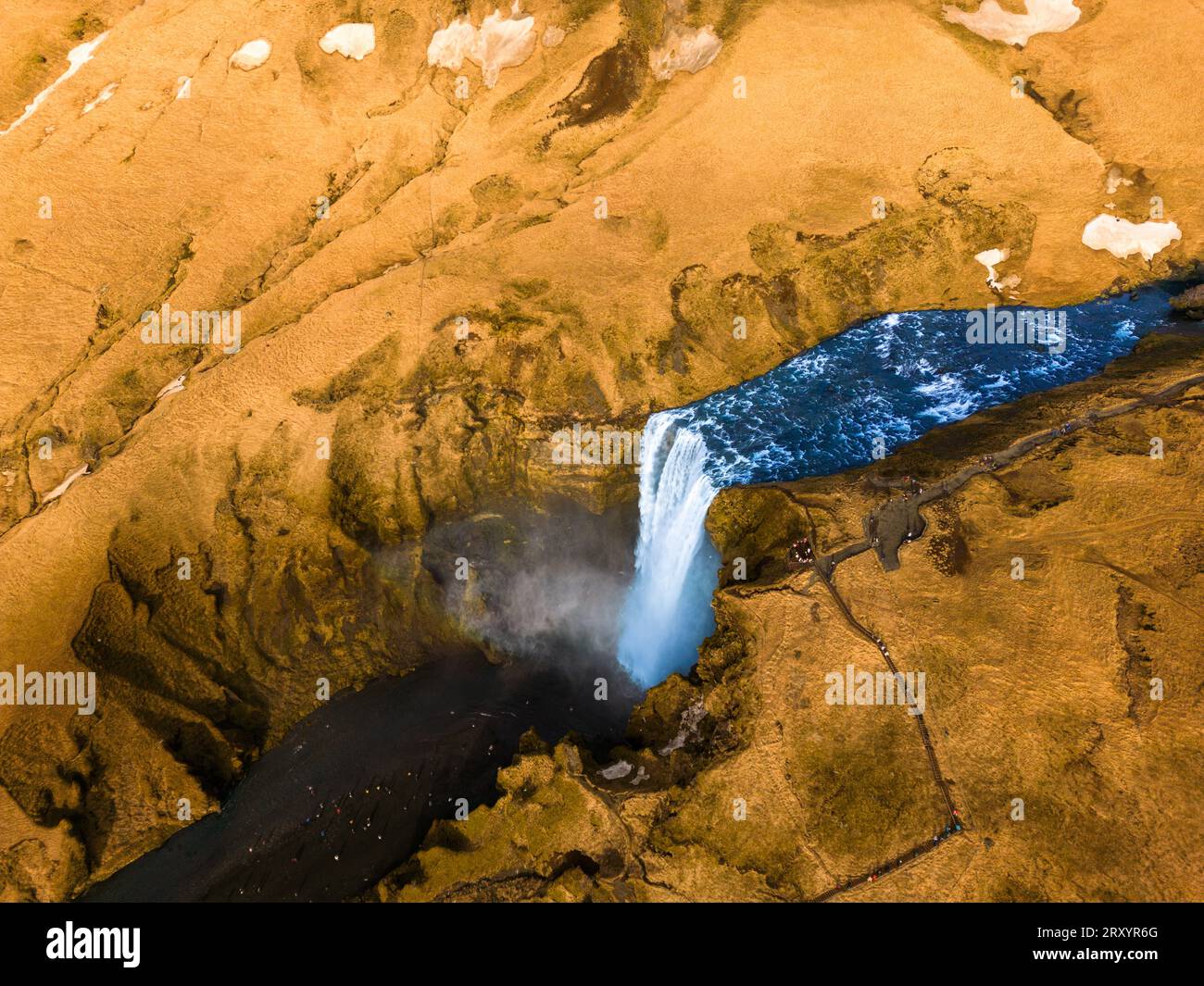Aerial view of large waterfall in Iceland with stream pouring down from ...
