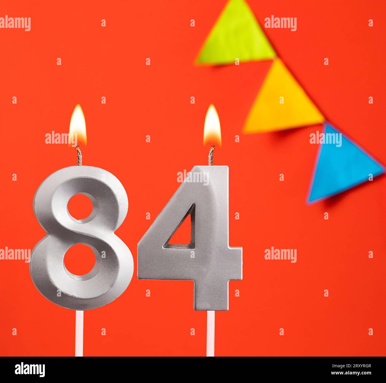 Birthday card - Number 84 candle in orange background Stock Photo - Alamy