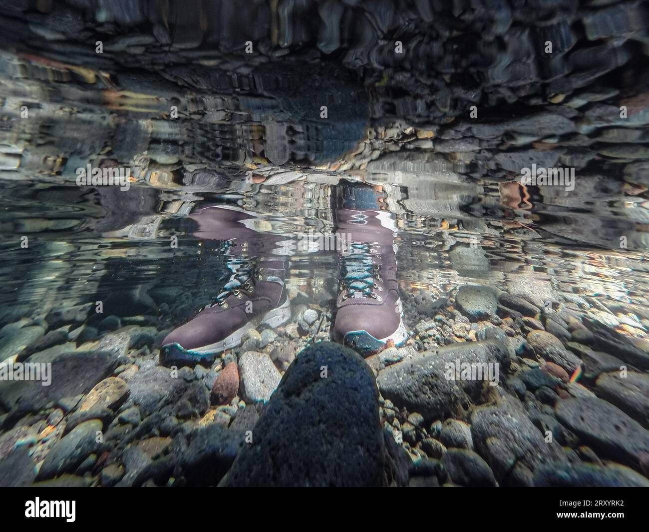 underwater view of submerged boots in a rocky stream Stock Photo - Alamy