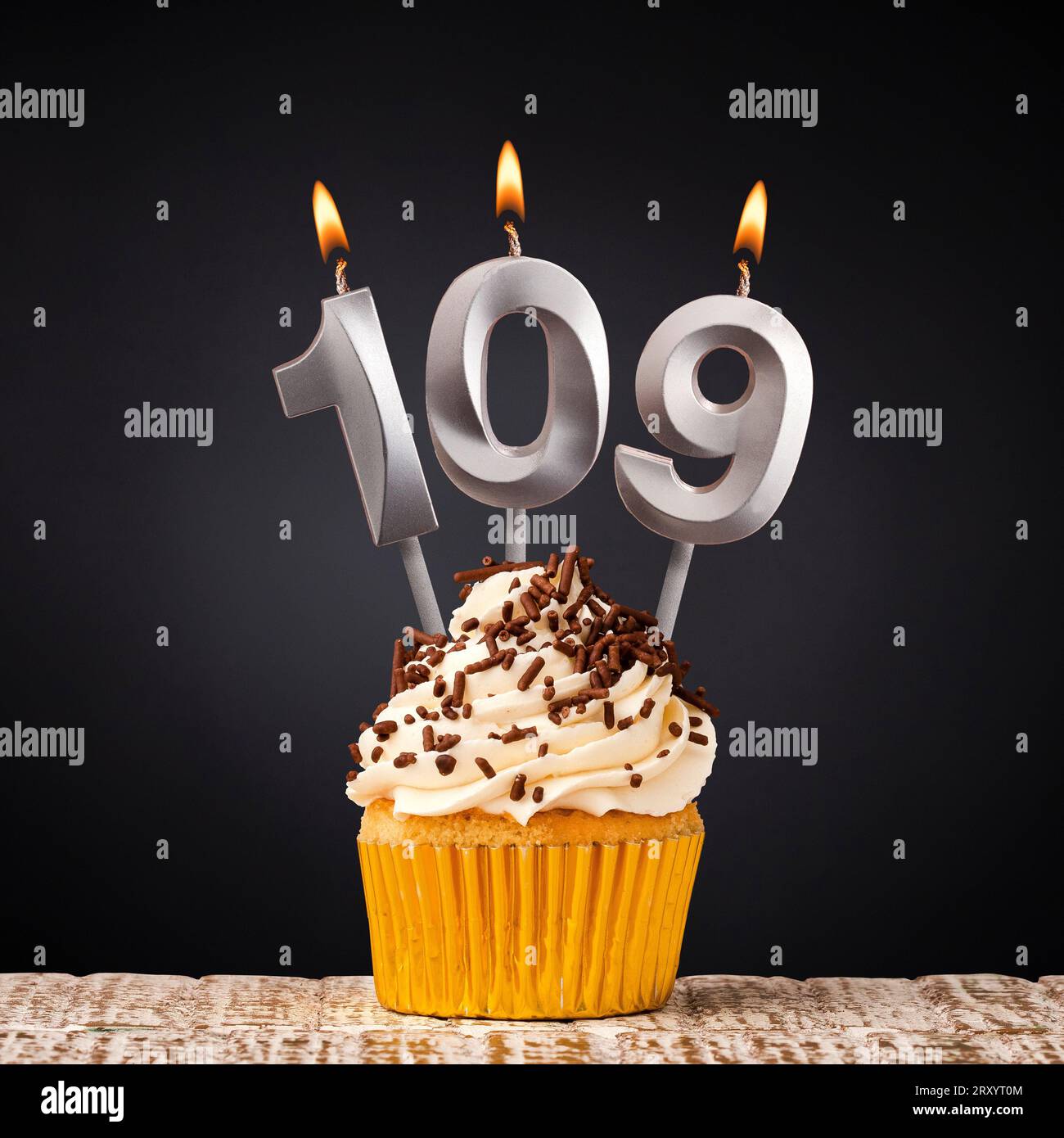 Birthday candle number 109 - Anniversary cupcake on black background ...