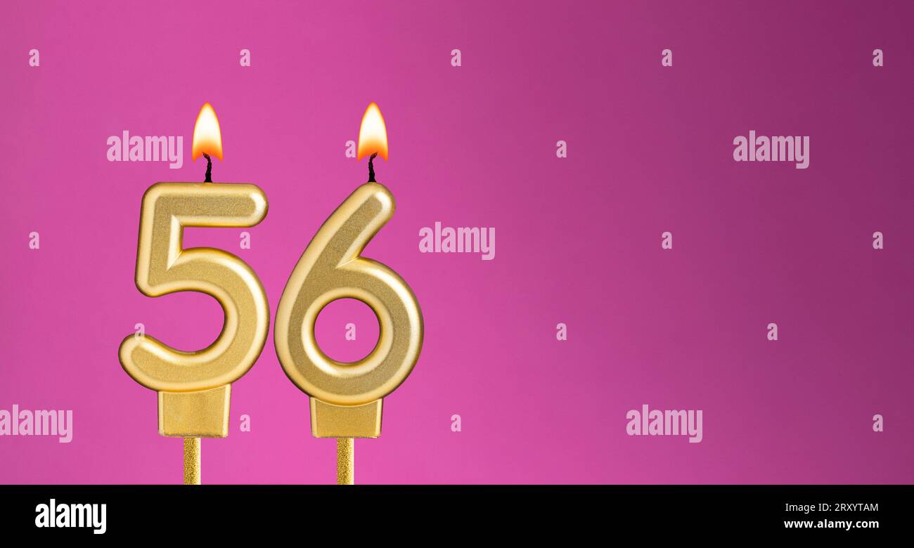 Birthday card with candle number 56 - purple background Stock Photo - Alamy