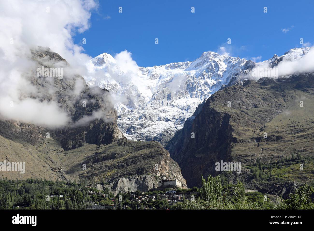 Baltit Fort below the snowy peaks of Ultar Sar in northern Pakistan ...