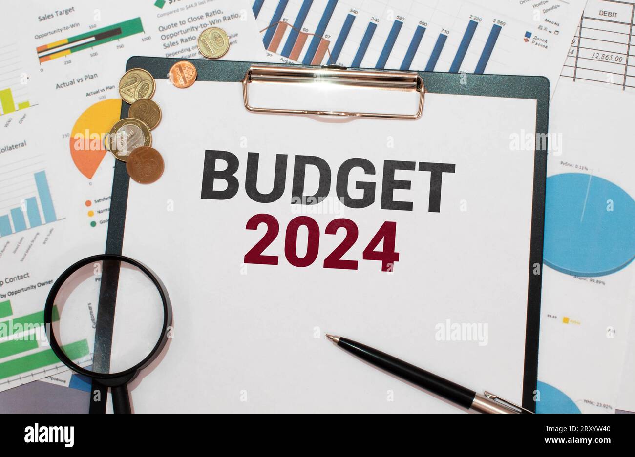 Concept of Budget 2024 write on sticky notes isolated on Wooden Table ...