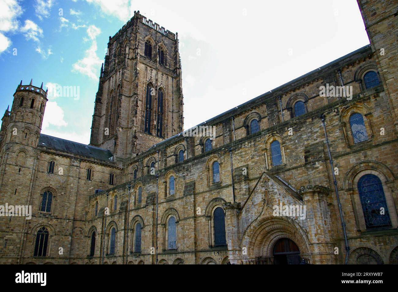 Durham Cathedral tower under a blue cloudy sky. Durham, UK Stock Photo ...