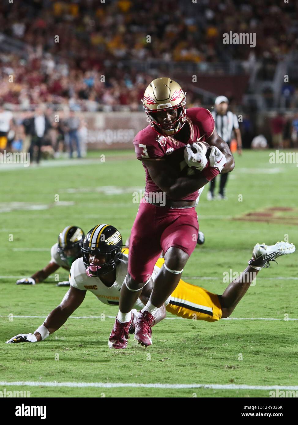 Florida State running back Trey Benson (3) runs for a touchdown past a ...
