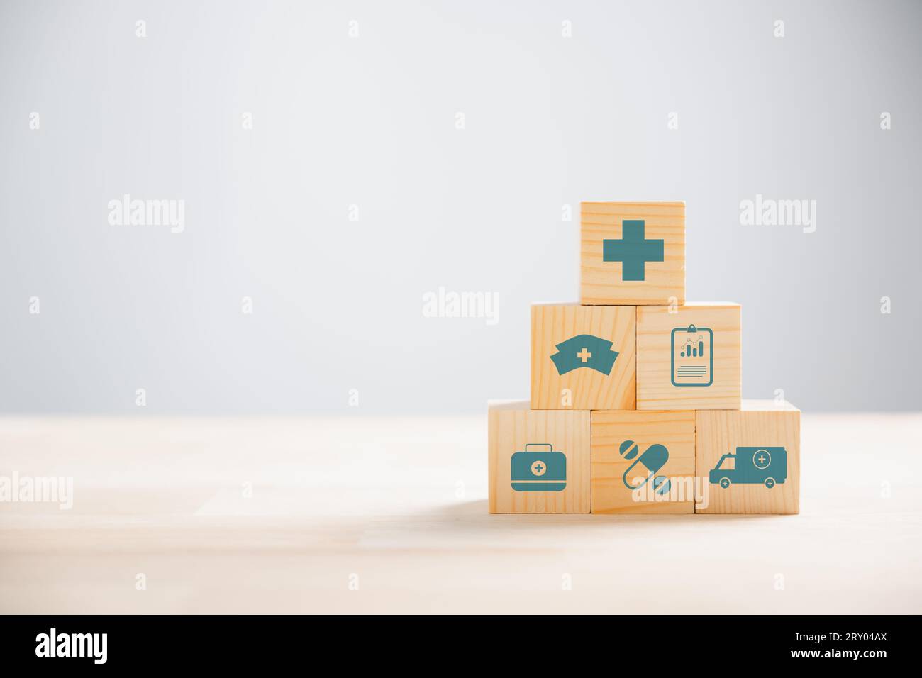 Medical symbols on wooden blocks stacked Stock Photo - Alamy