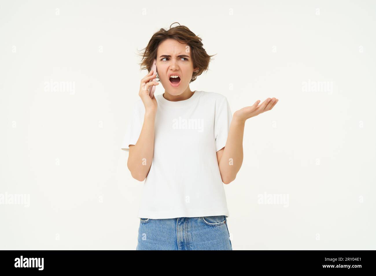 Portrait of angry lady talking on phone, frustrated woman shouting at ...