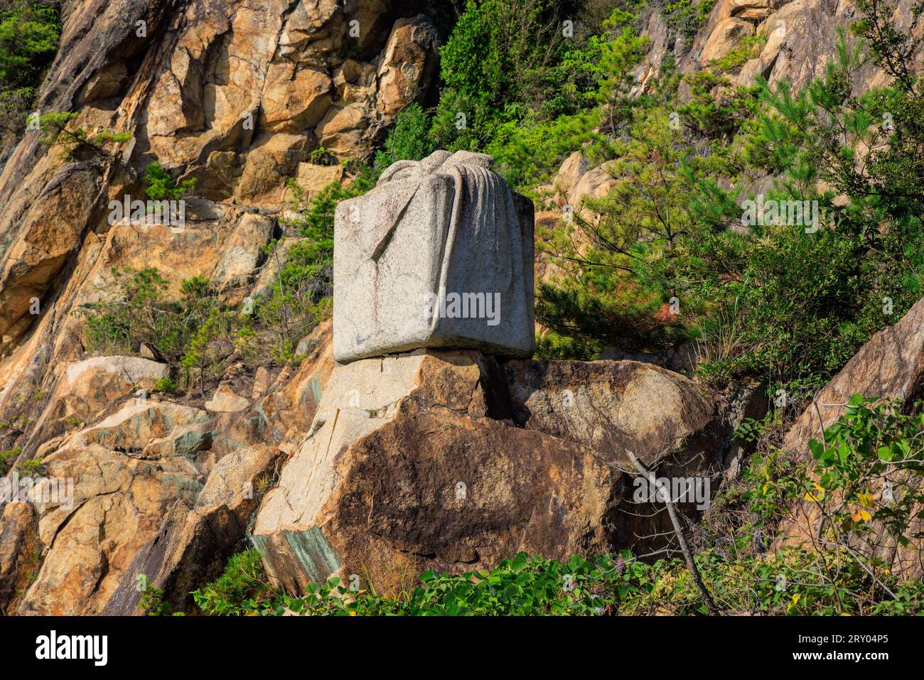 Giant granite stone statue atop rock at Osaka Castle Quarry on Shodo ...