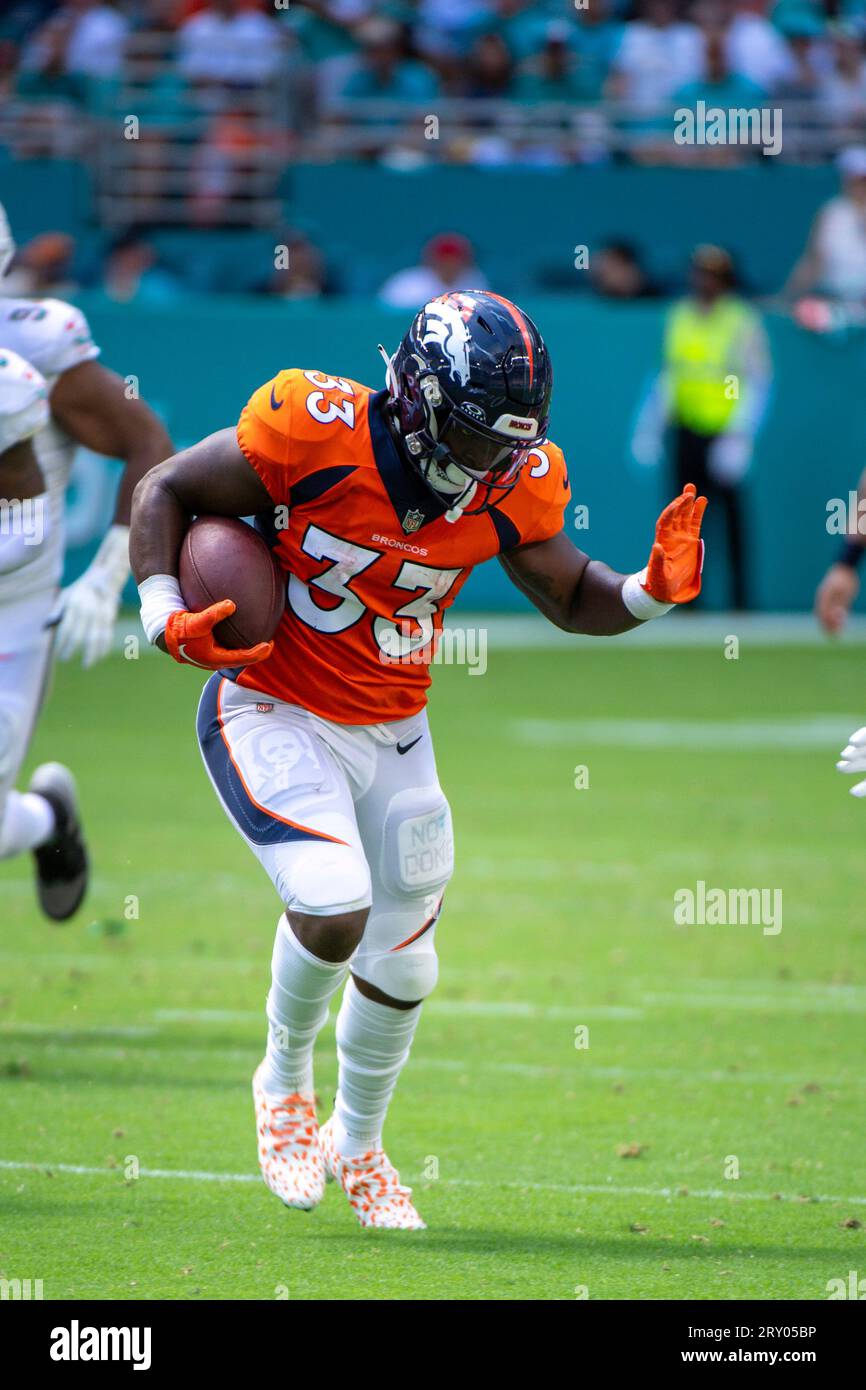 Denver Broncos running back Javonte Williams (33) runs with the ball ...