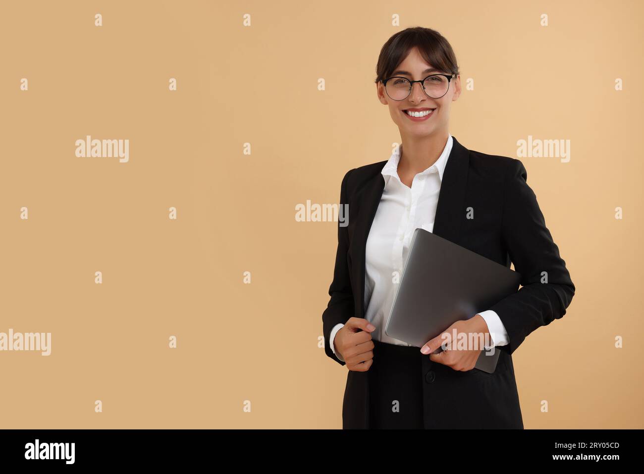 Happy secretary with laptop on beige background. Space for text Stock ...