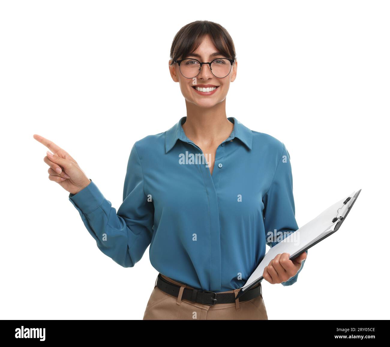 Happy secretary with clipboard pointing at something on white ...