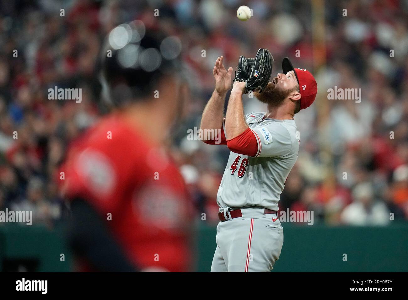 Cincinnati Reds relief pitcher Buck Farmer catches a popup hit by ...