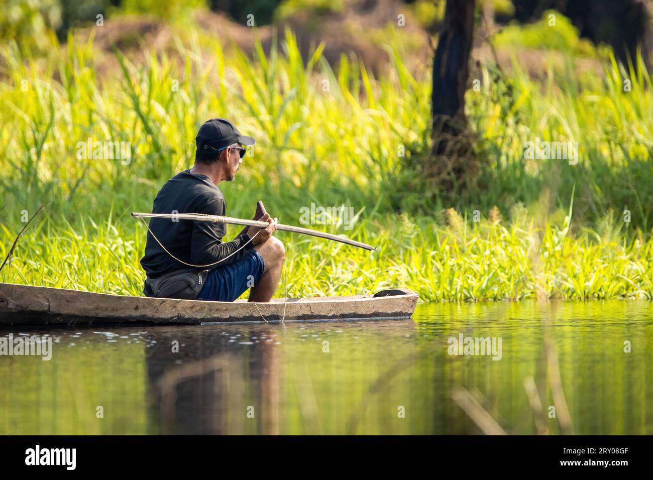 Traditional native amazon people bow spear fishing in South America ...
