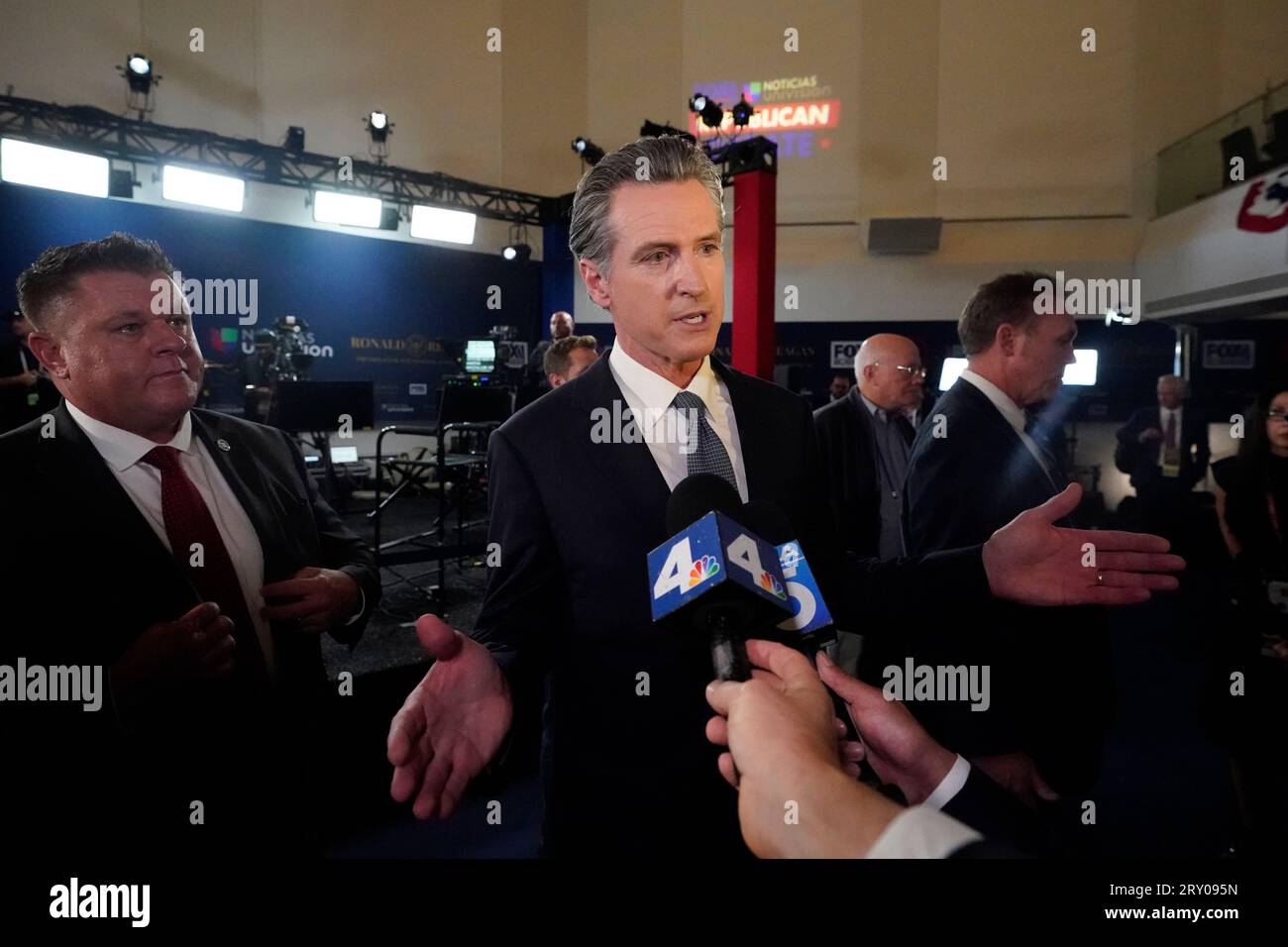 California Gov. Gavin Newsom fields questions in the spin room before a ...