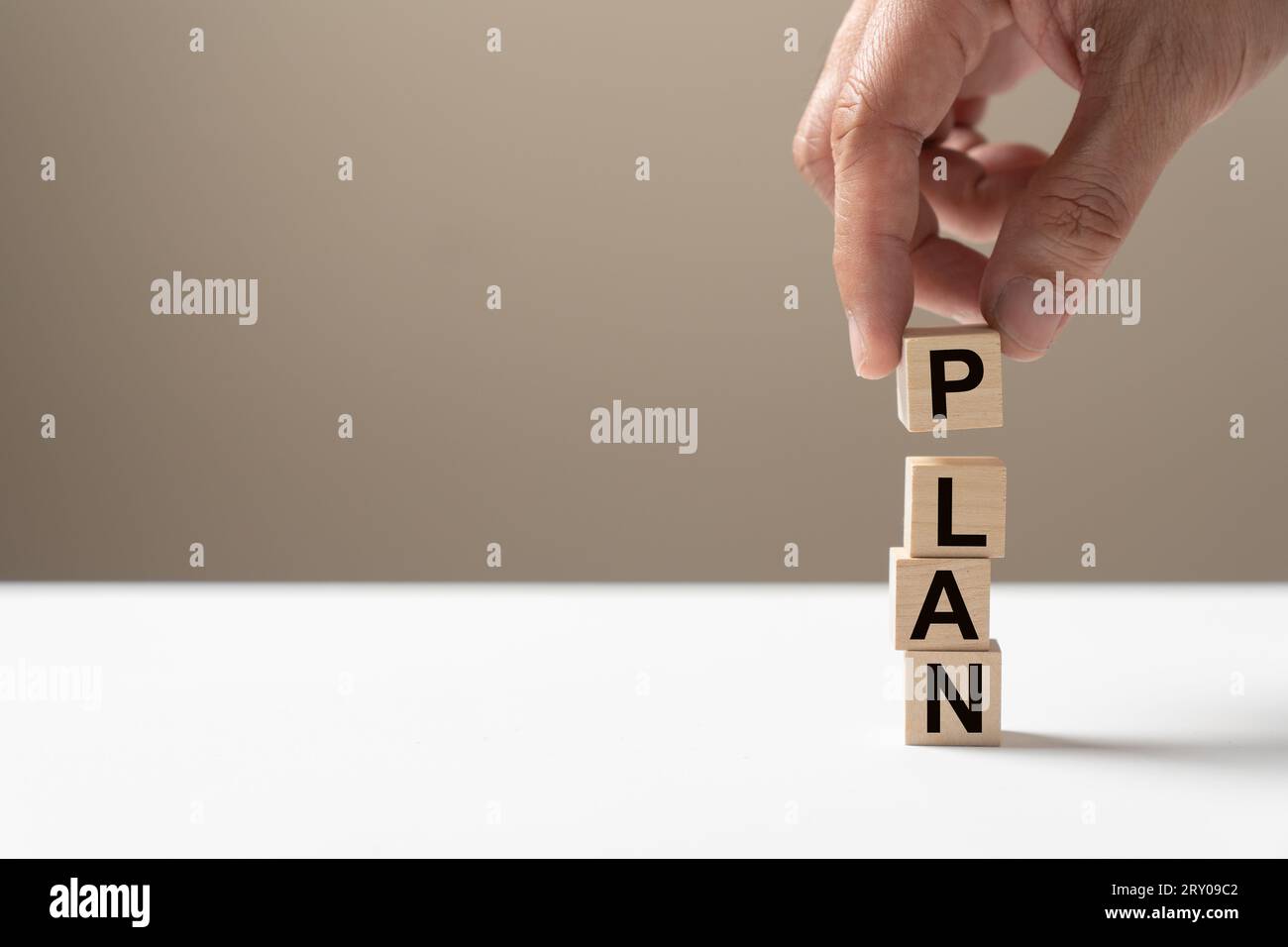 Hand putting wooden cube block for stacking plan wording concept Stock ...