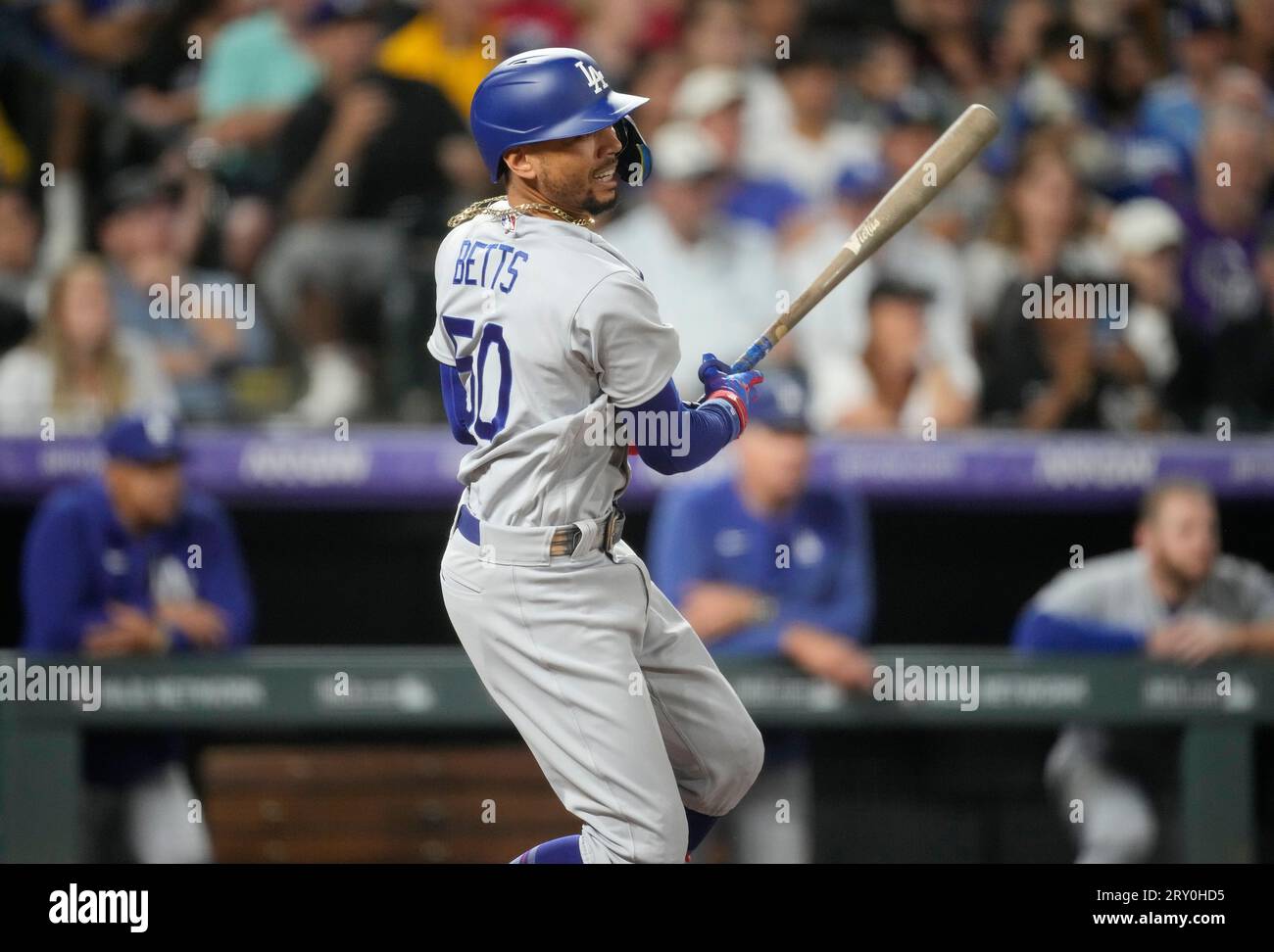 Los Angeles Dodgers' Mookie Betts follows the flight of his RBI single ...