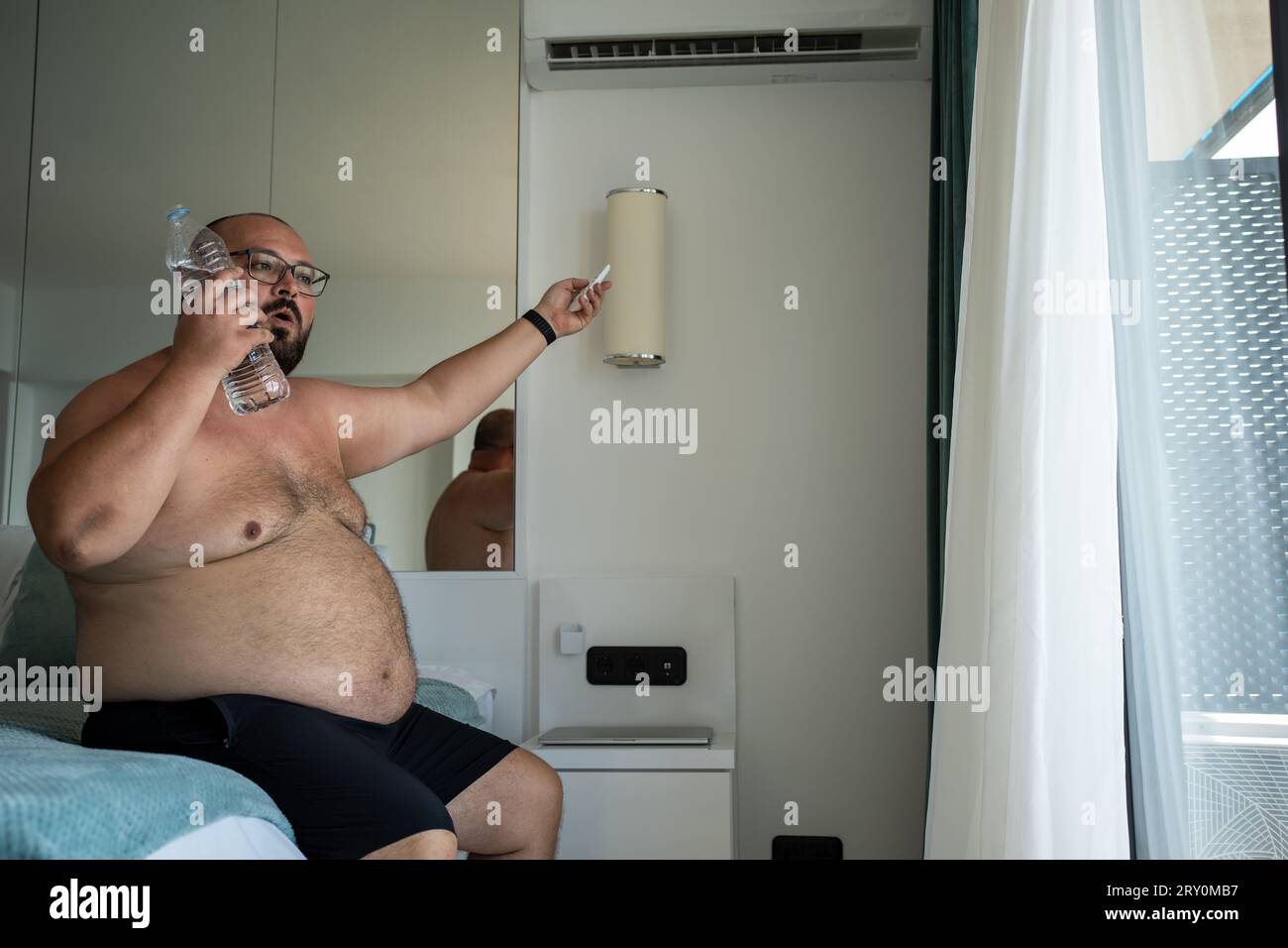 Obese male not tolerate summer weather suffocates from stuffiness. Fat ...