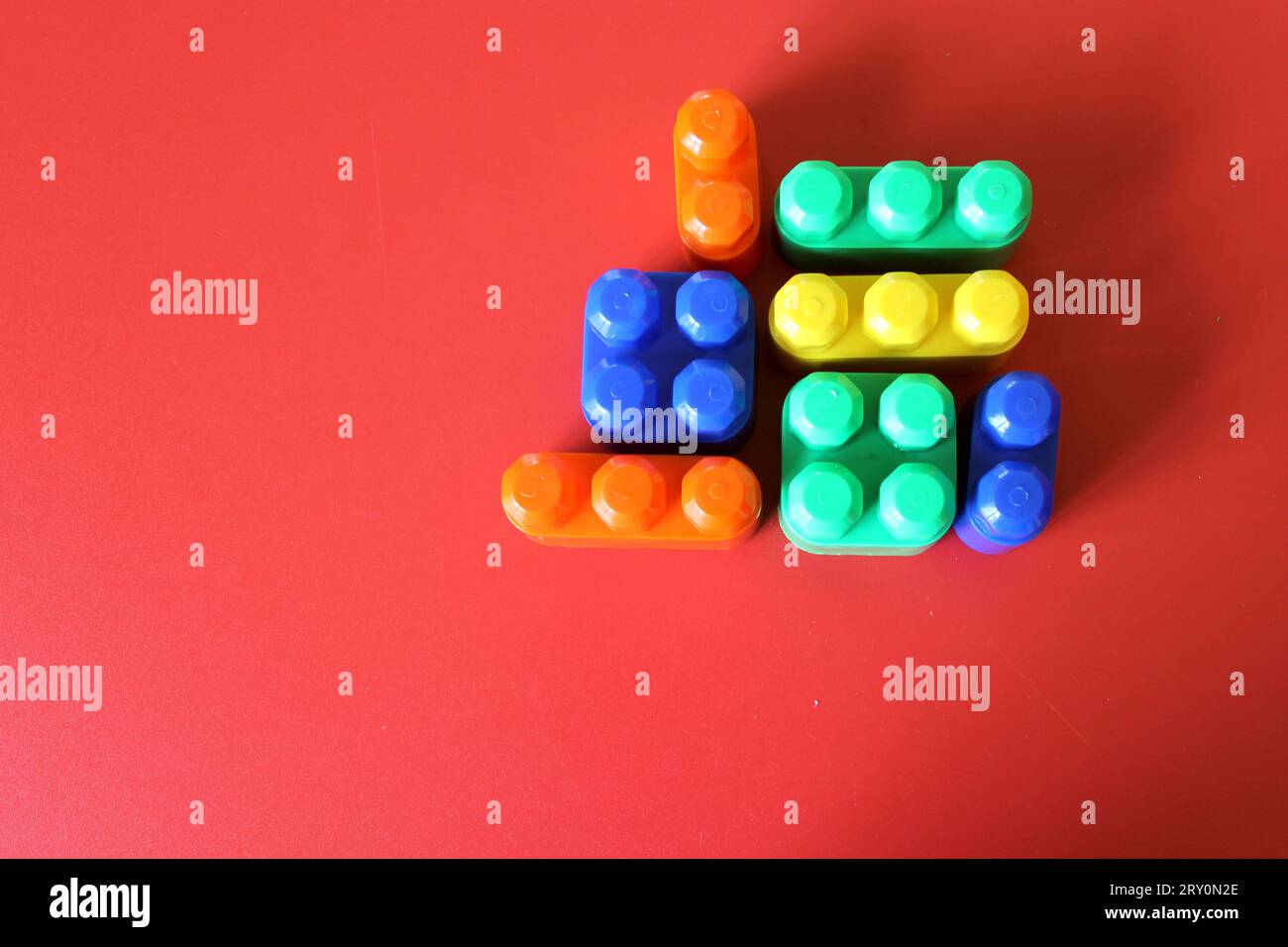 Pieces of plastic rainbow multicolored buildable toy blocks formed and ...