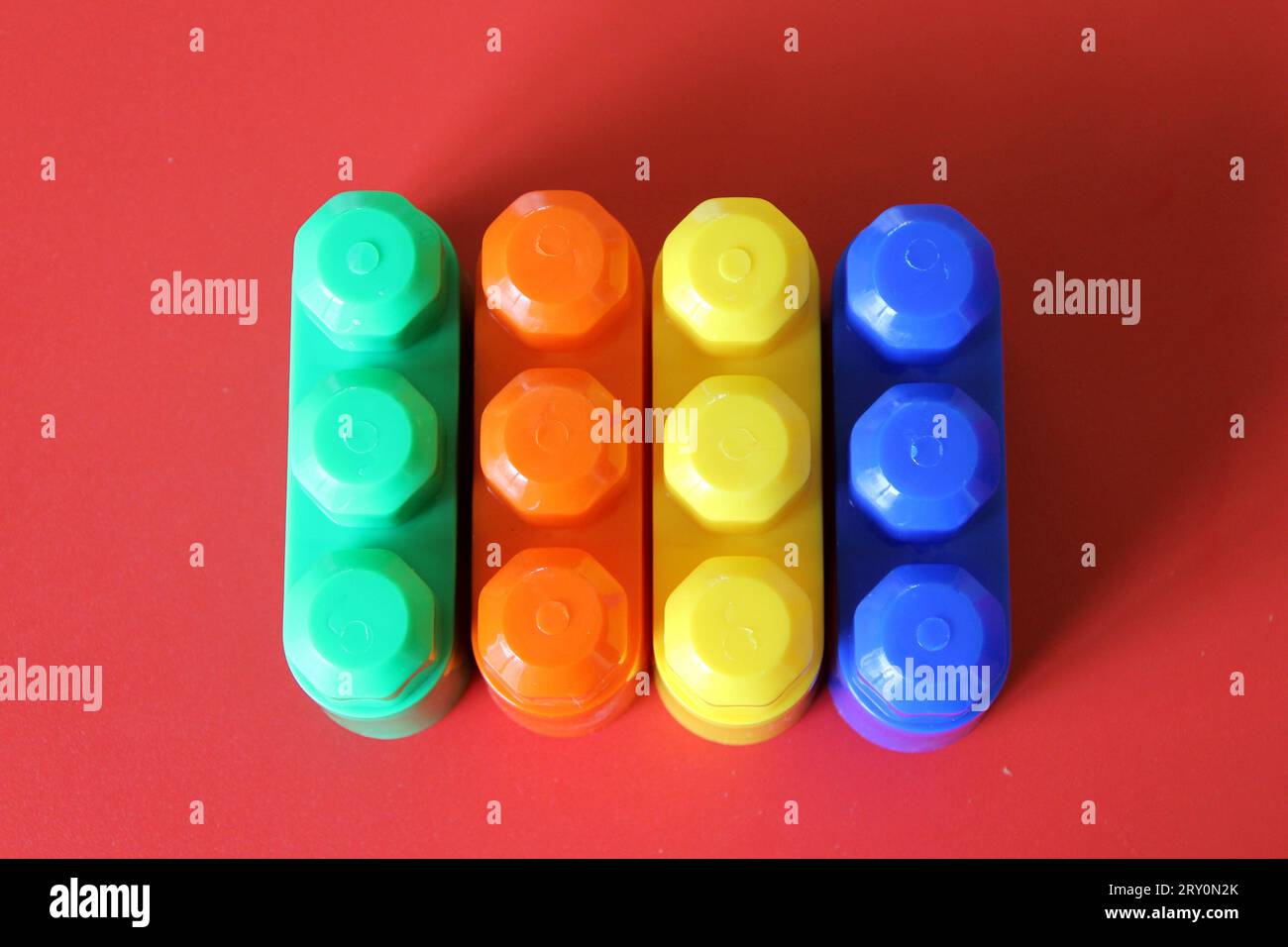 Pieces of plastic rainbow multicolored buildable toy blocks formed and ...