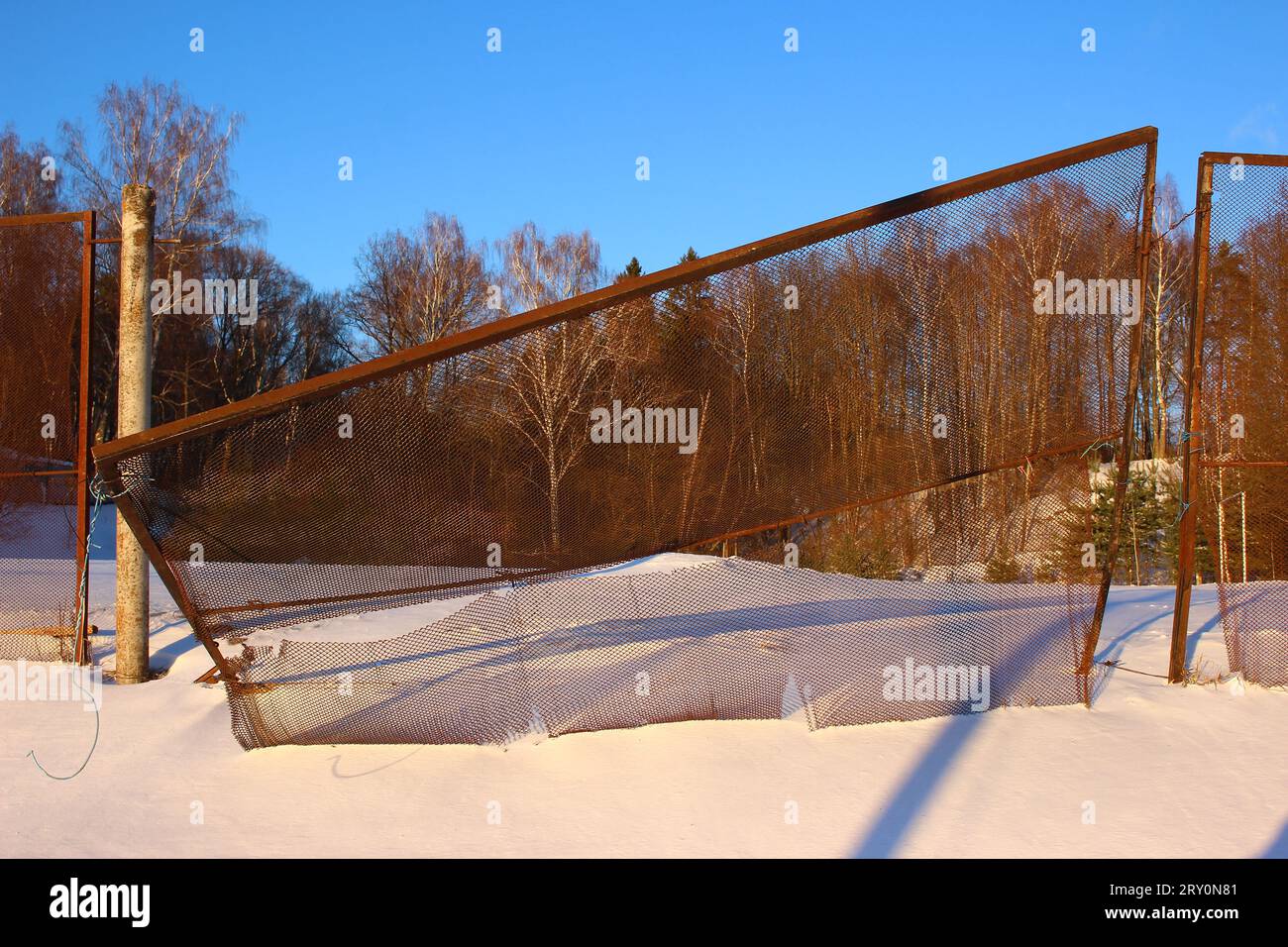 Collapsed section of metal mesh fence Stock Photo - Alamy