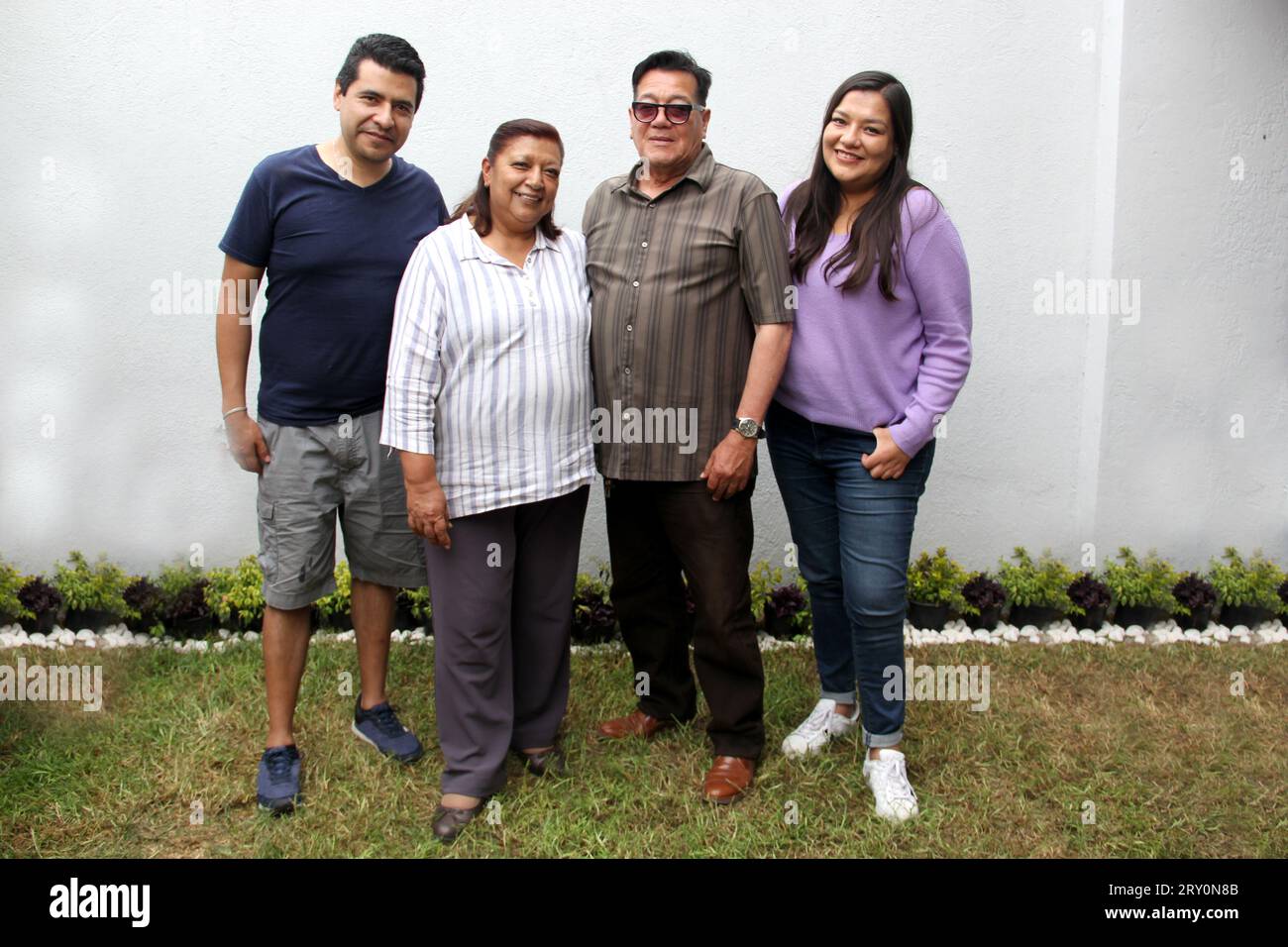 Latin family of parents and children pose for the photo as a family ...