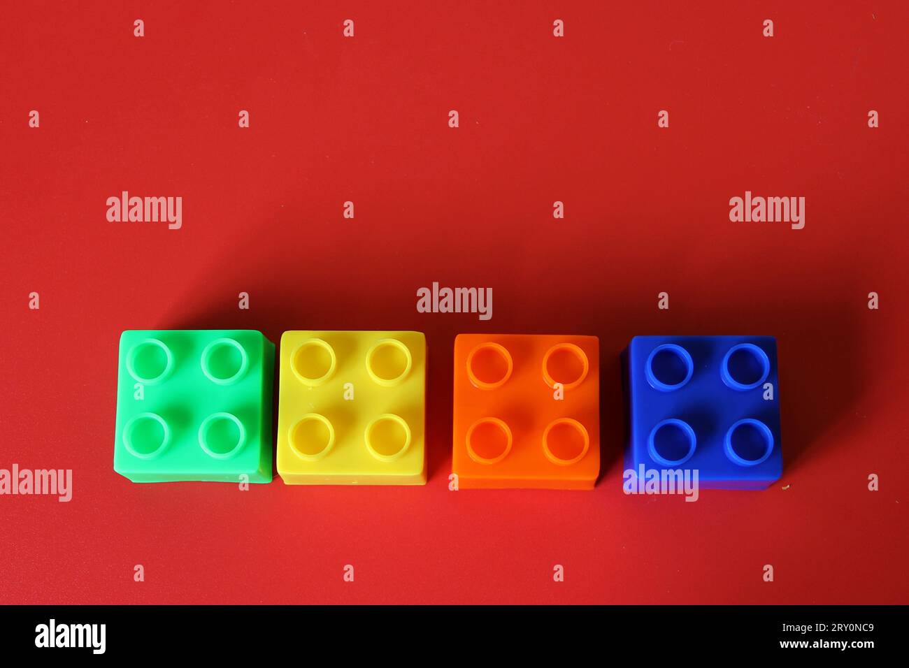 Pieces of plastic rainbow multicolored buildable toy blocks formed and ...